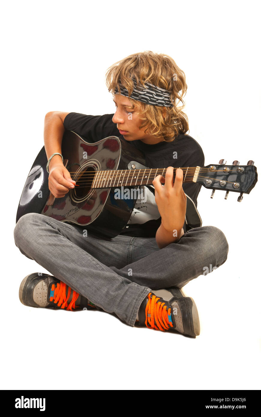 Teen boy playing acoustic guitar isolated on white background Stock ...