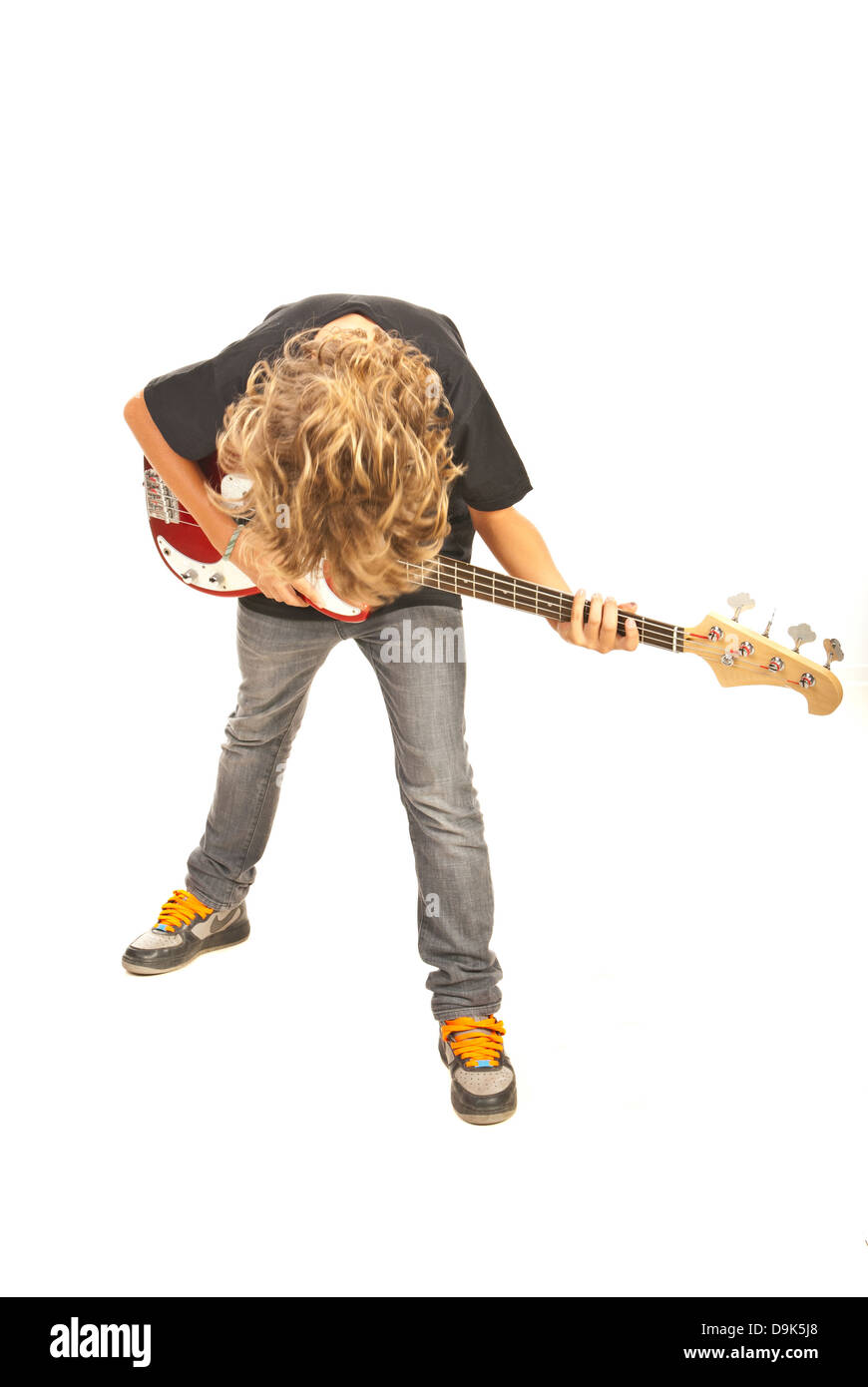 Rocker boy playing bass guitar isolated on white background Stock Photo ...