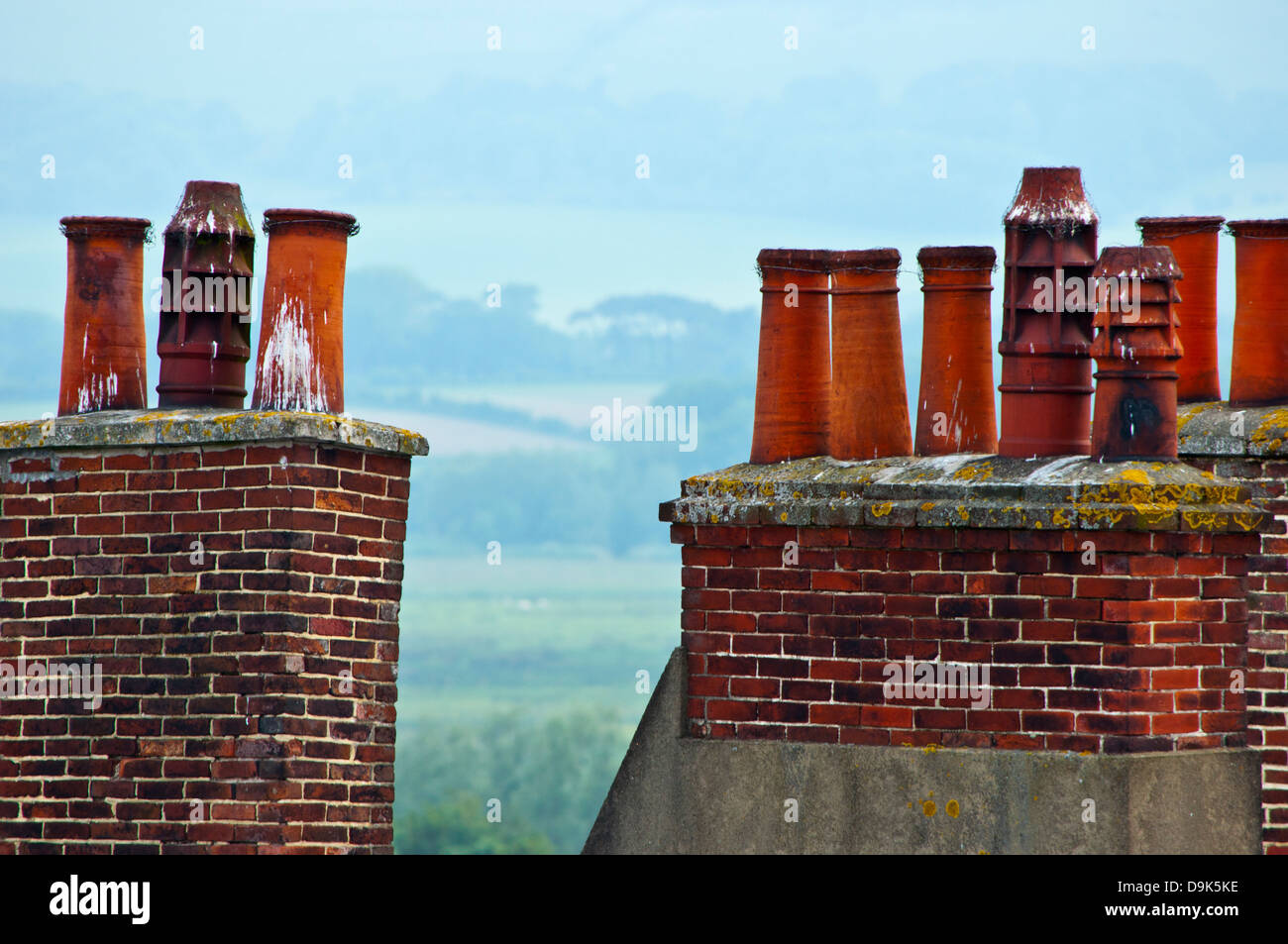 Brick and clay chimney pots Stock Photo - Alamy