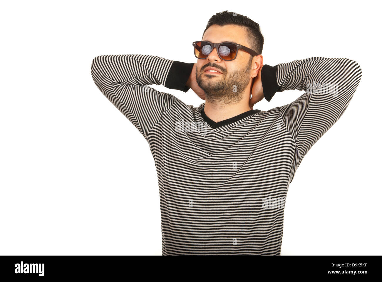 Relaxing young man with sunglasses standing with hands to nape isolated ...