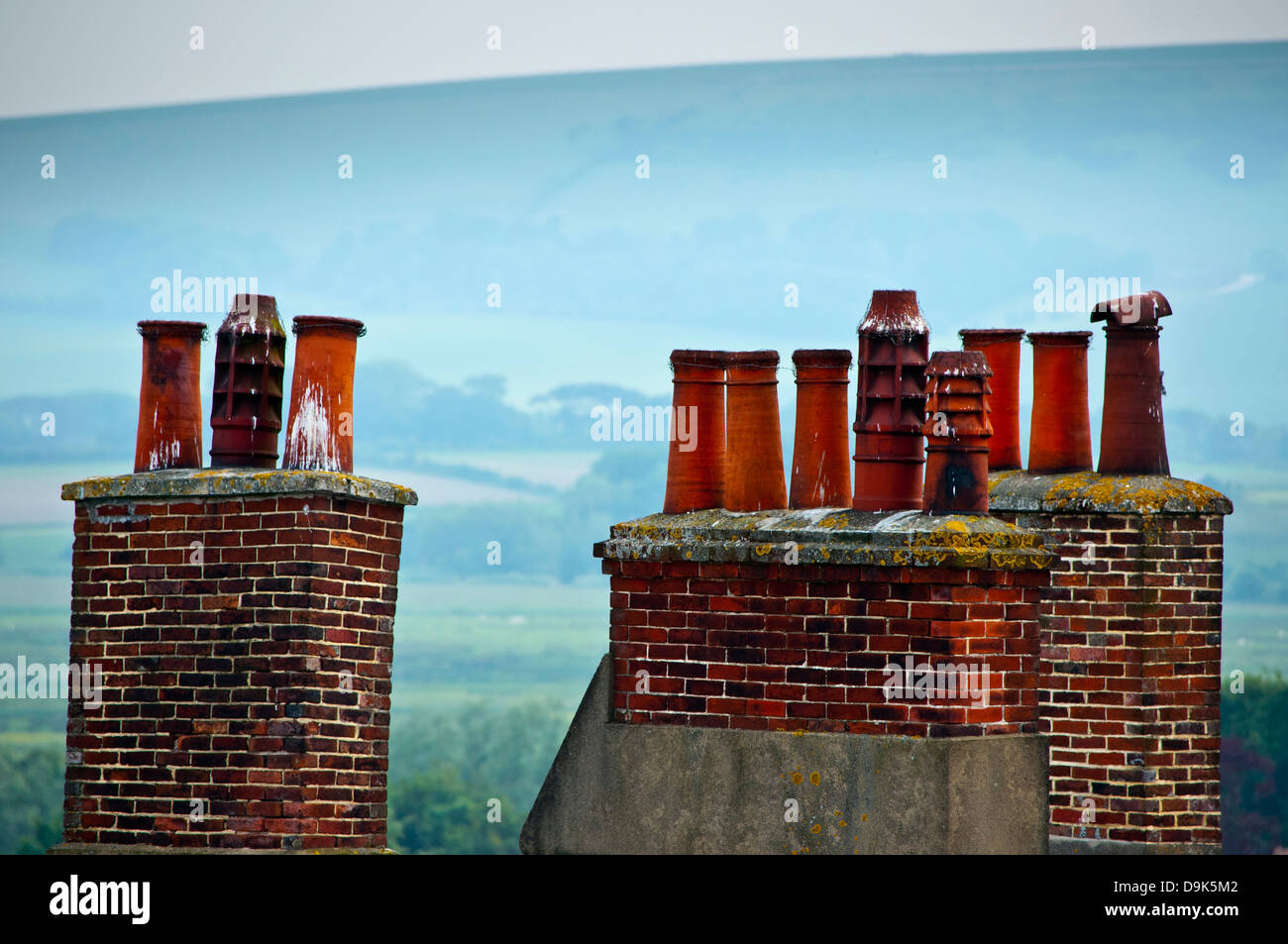 Brick and clay chimney pots Stock Photo - Alamy