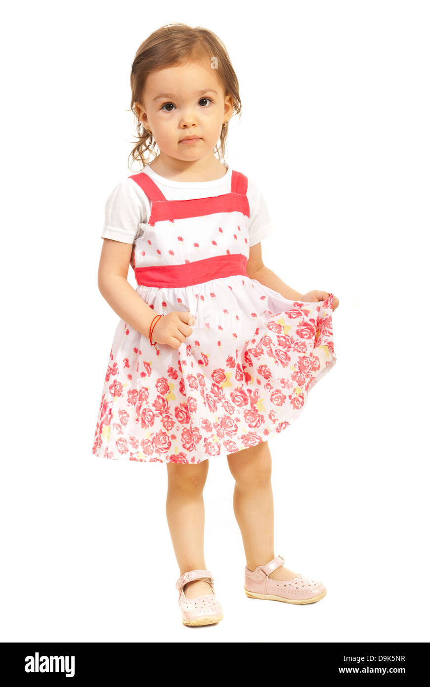 Beautiful toddler girl posing in elegant dress isolated on white ...