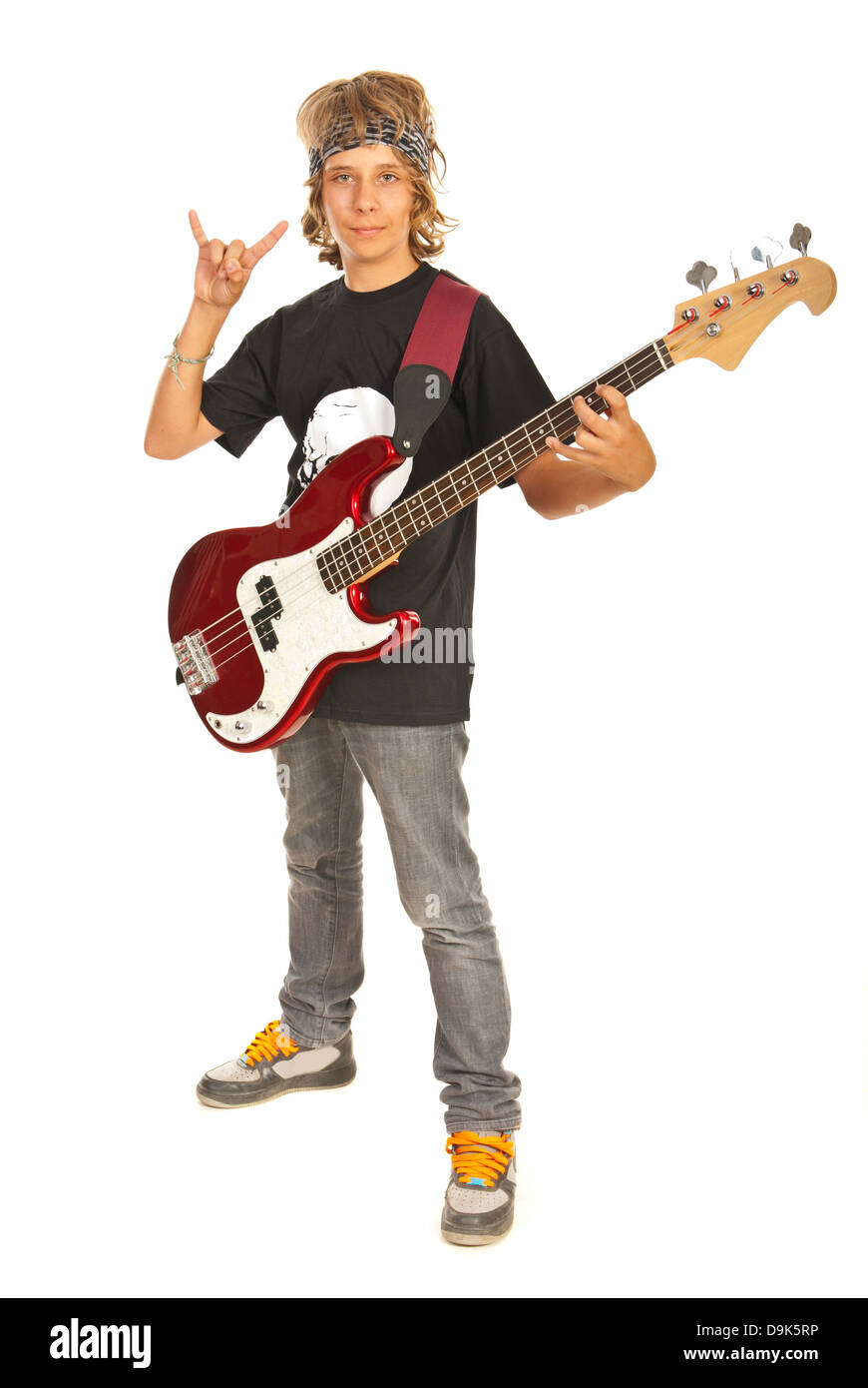 Rocker teenager boy with bass guitar gesturing isolated on white ...