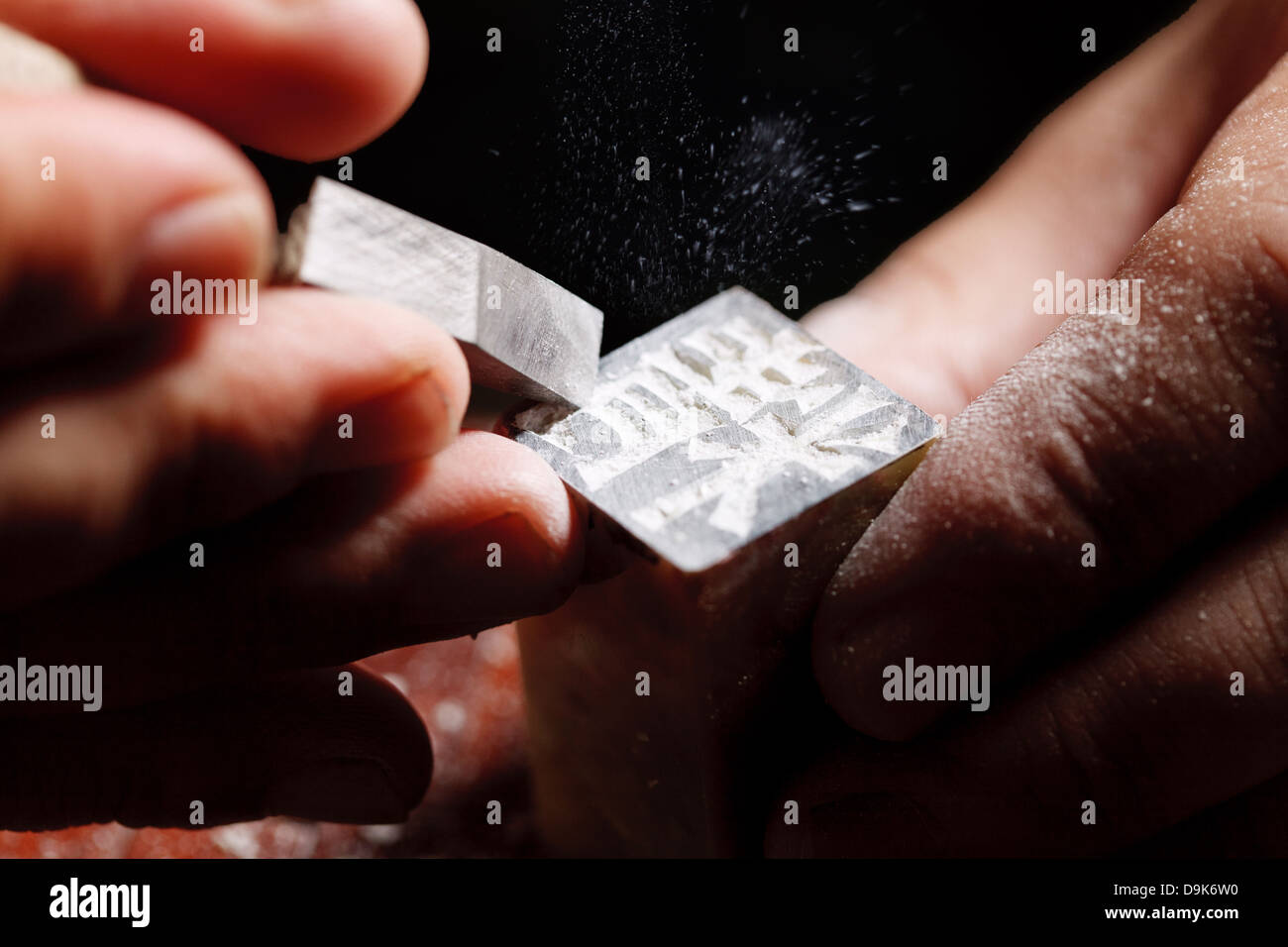 Craftsman carving Chinese character into a Chinese chop Stock Photo - Alamy