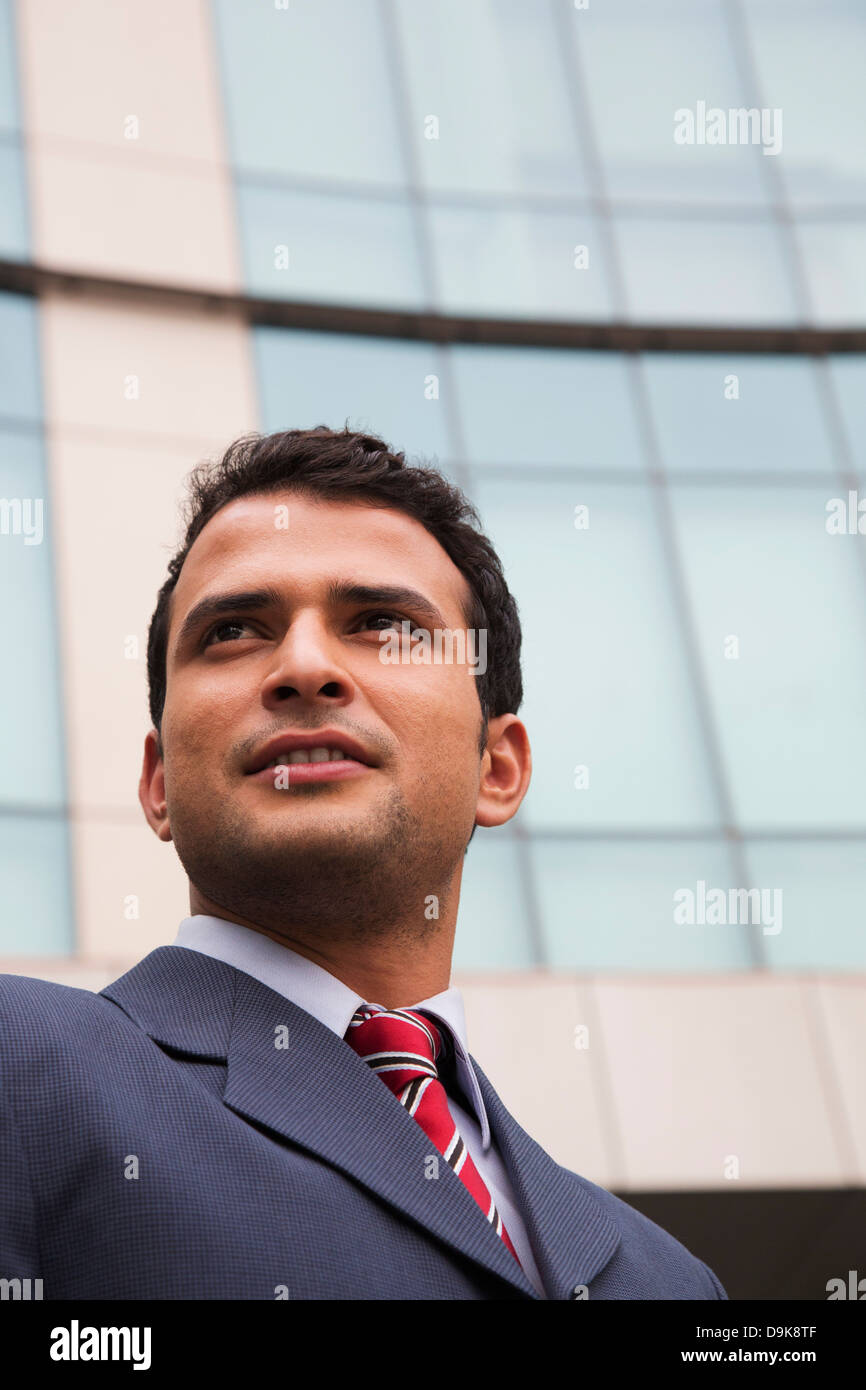 Low angle view of a businessman outside an office building Stock Photo ...