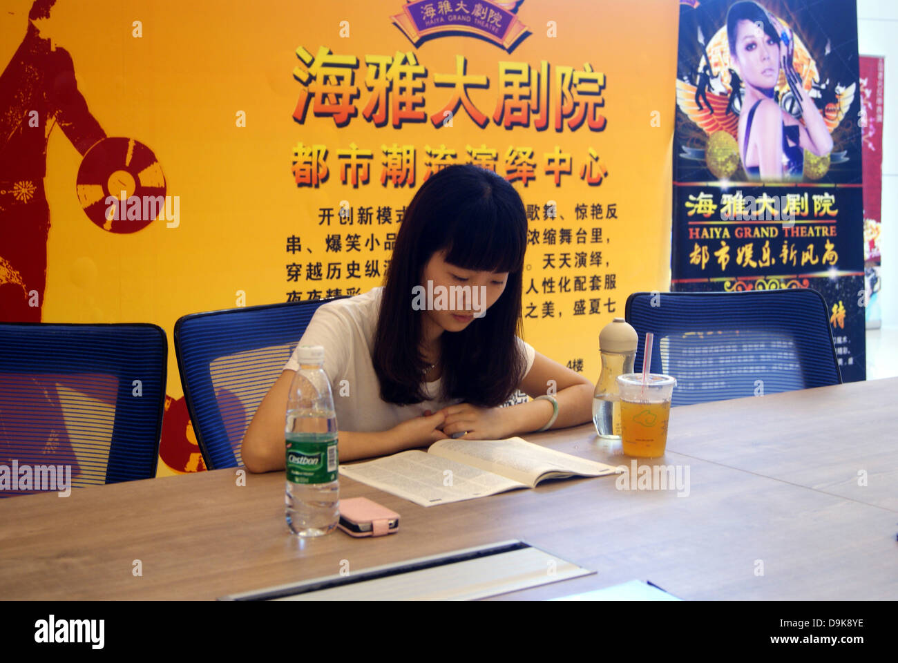 Shenzhen China: a young girl is reading a magazine Stock Photo - Alamy