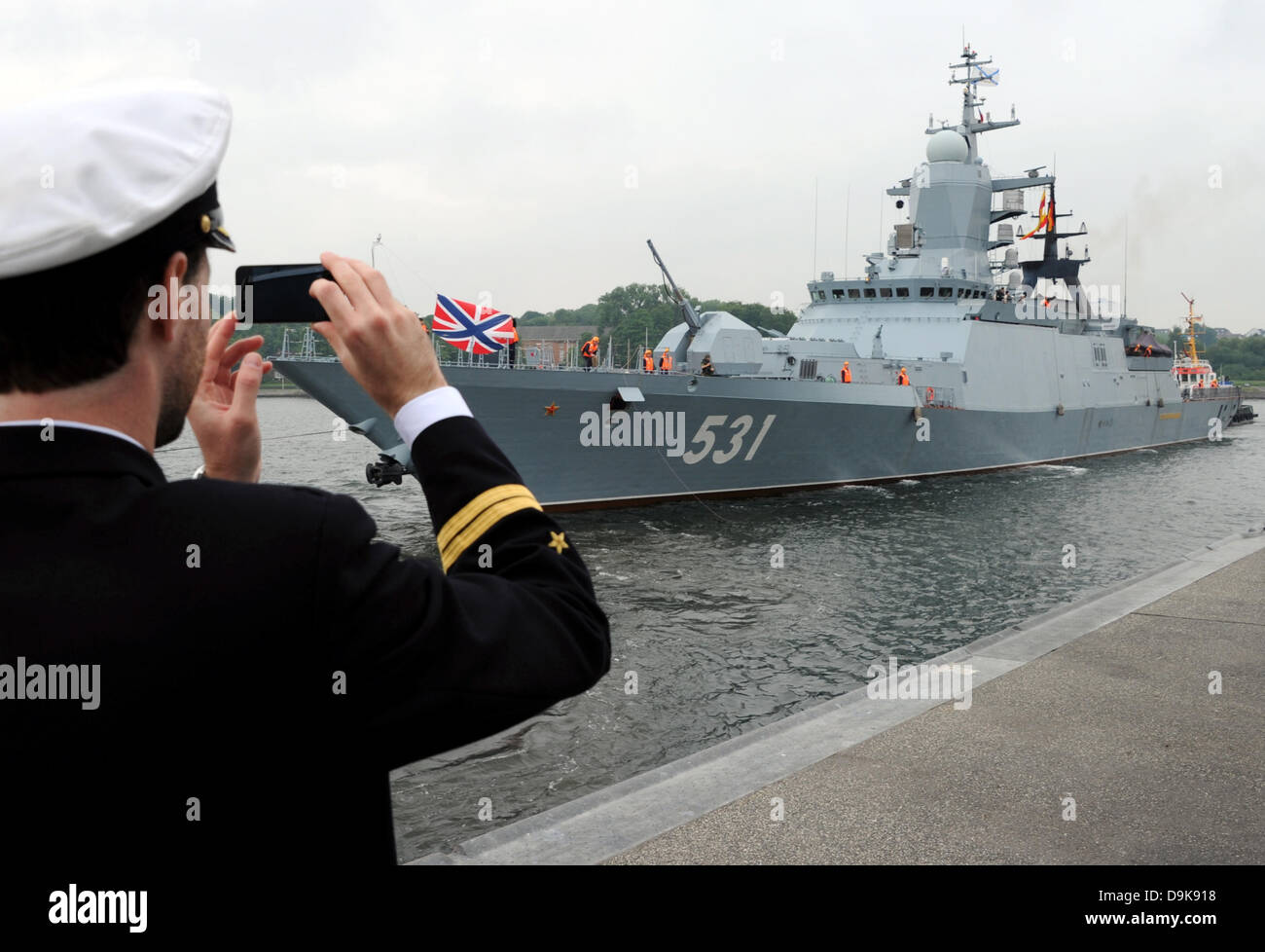 Kiel, Germany. 21st June, 2013. An officer of the German Navy takes a ...