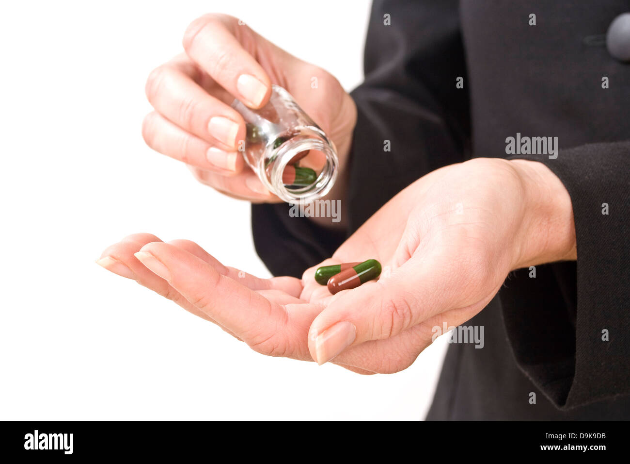Hand with tablets Stock Photo - Alamy