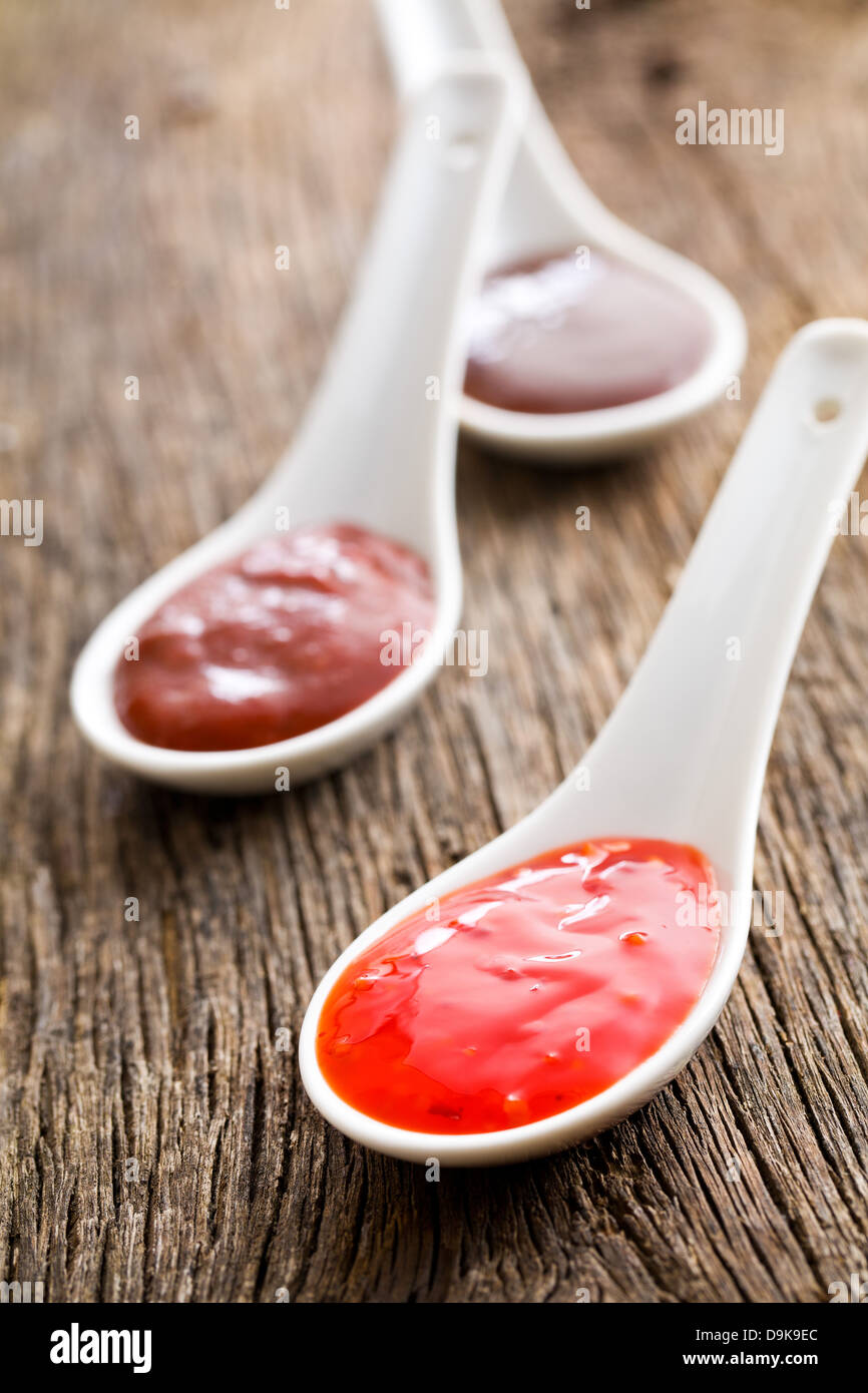 the various barbecue sauces in ceramic spoons Stock Photo - Alamy