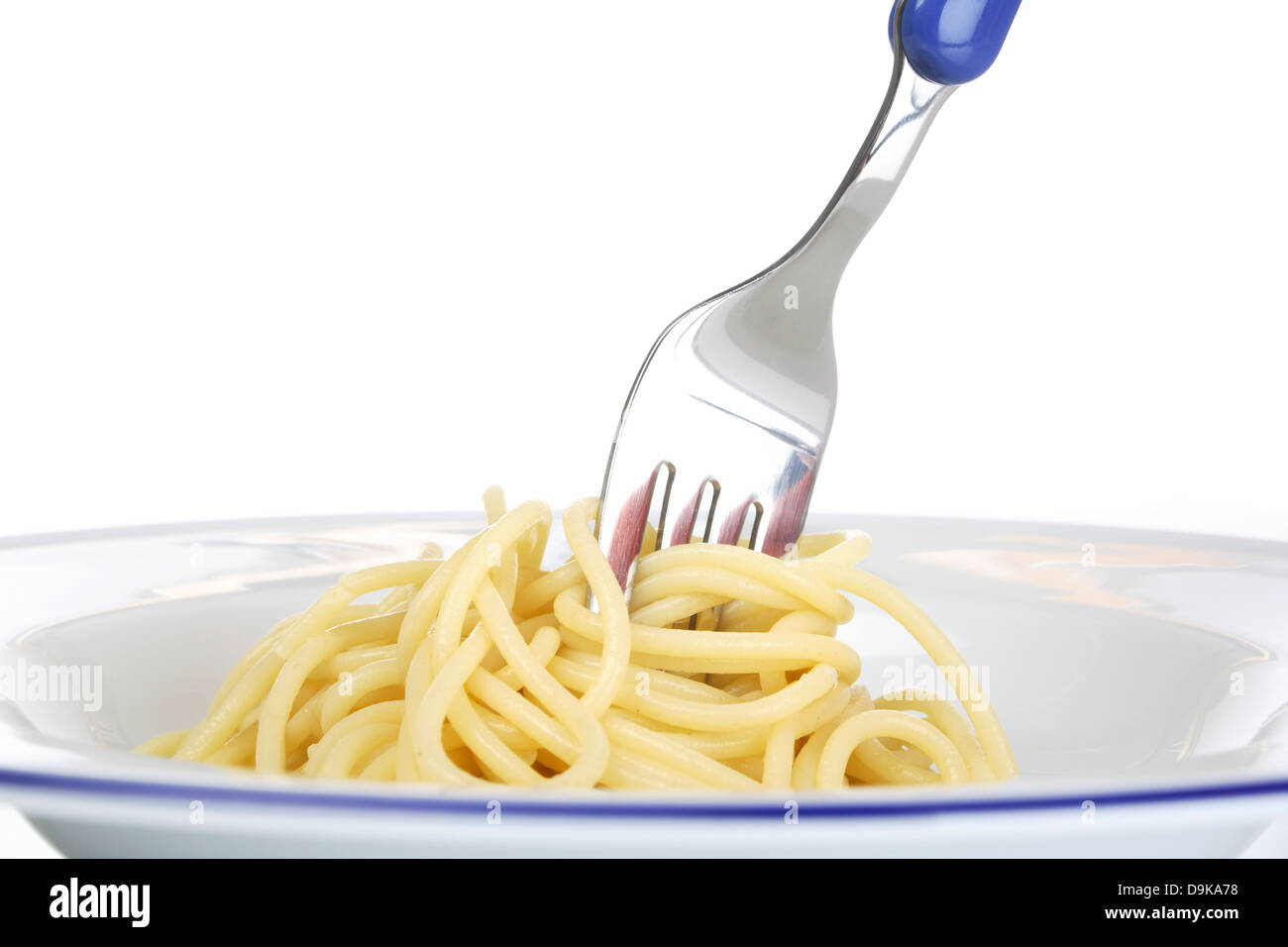 Spaghetti with plate and fork Stock Photo - Alamy