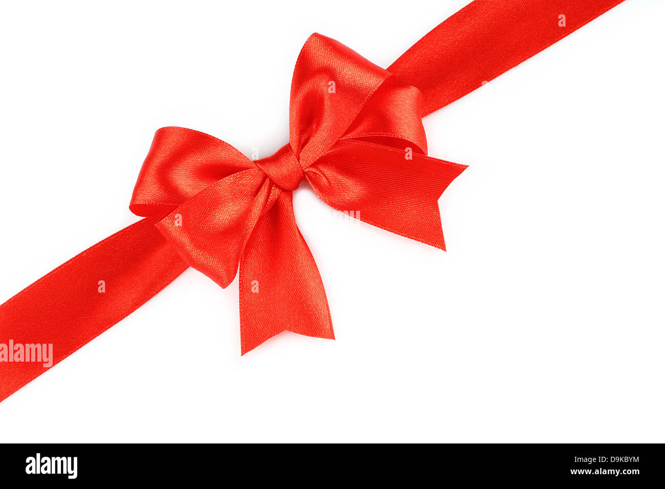Big red holiday bow on white background Stock Photo - Alamy