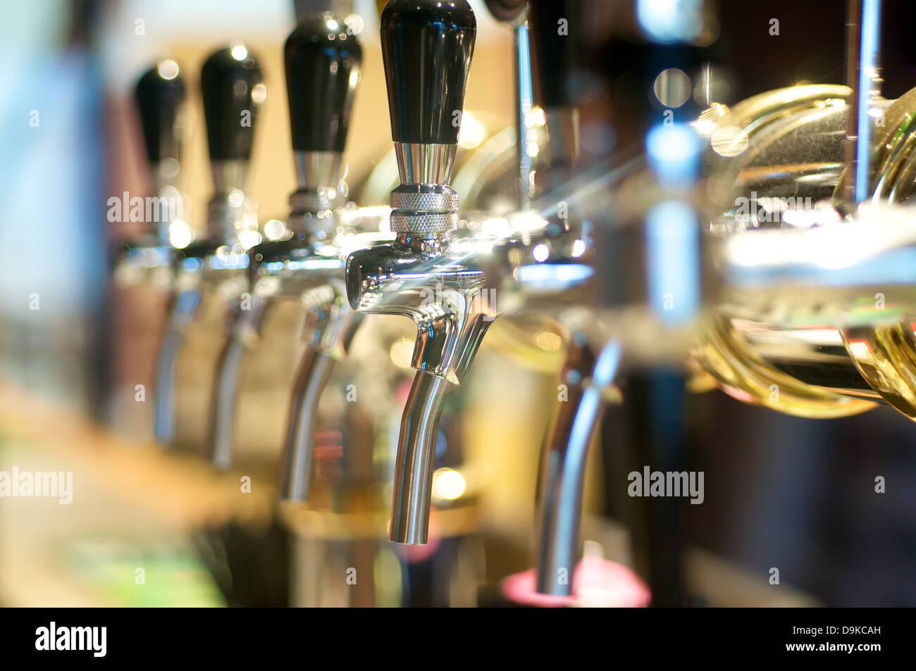 Beer taps in a row Stock Photo - Alamy