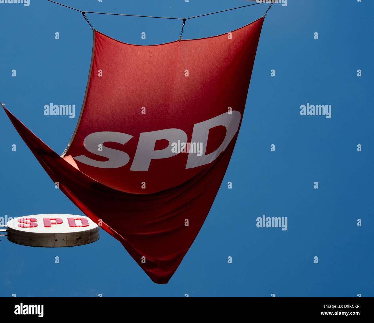 A sign and a flag with the logo of the Social Democratic Party of ...