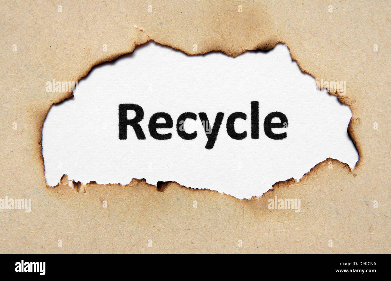 Recycle text in paper hole Stock Photo - Alamy