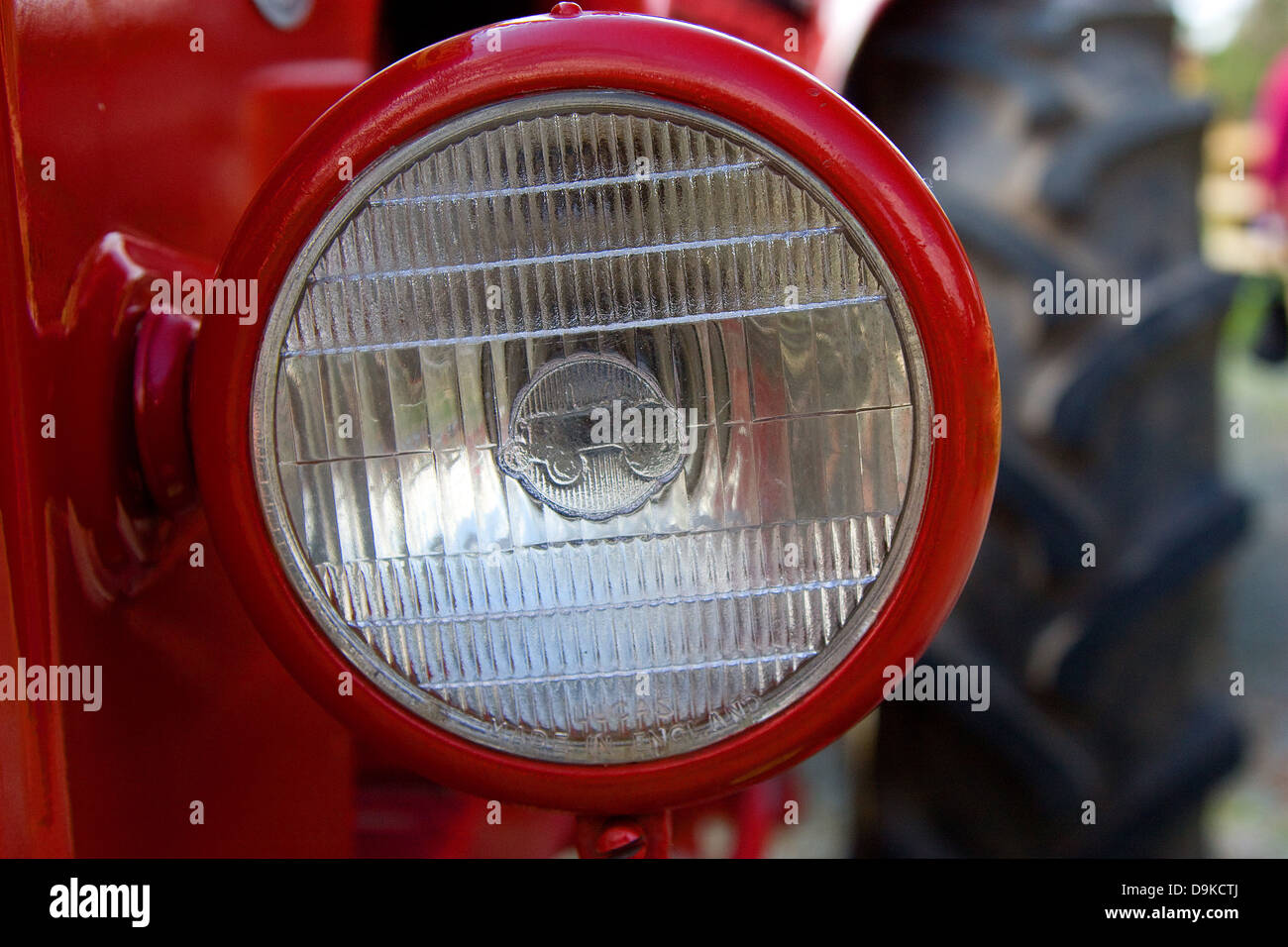 Close up vintage red tractor headlight Stock Photo - Alamy
