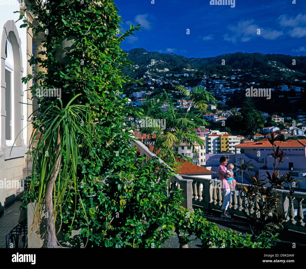 A mother on holiday holding her baby on the balcony of the Hotel Monte ...