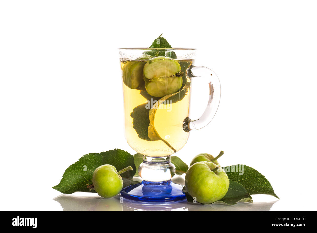 apple tea in a cup on a white background Stock Photo - Alamy