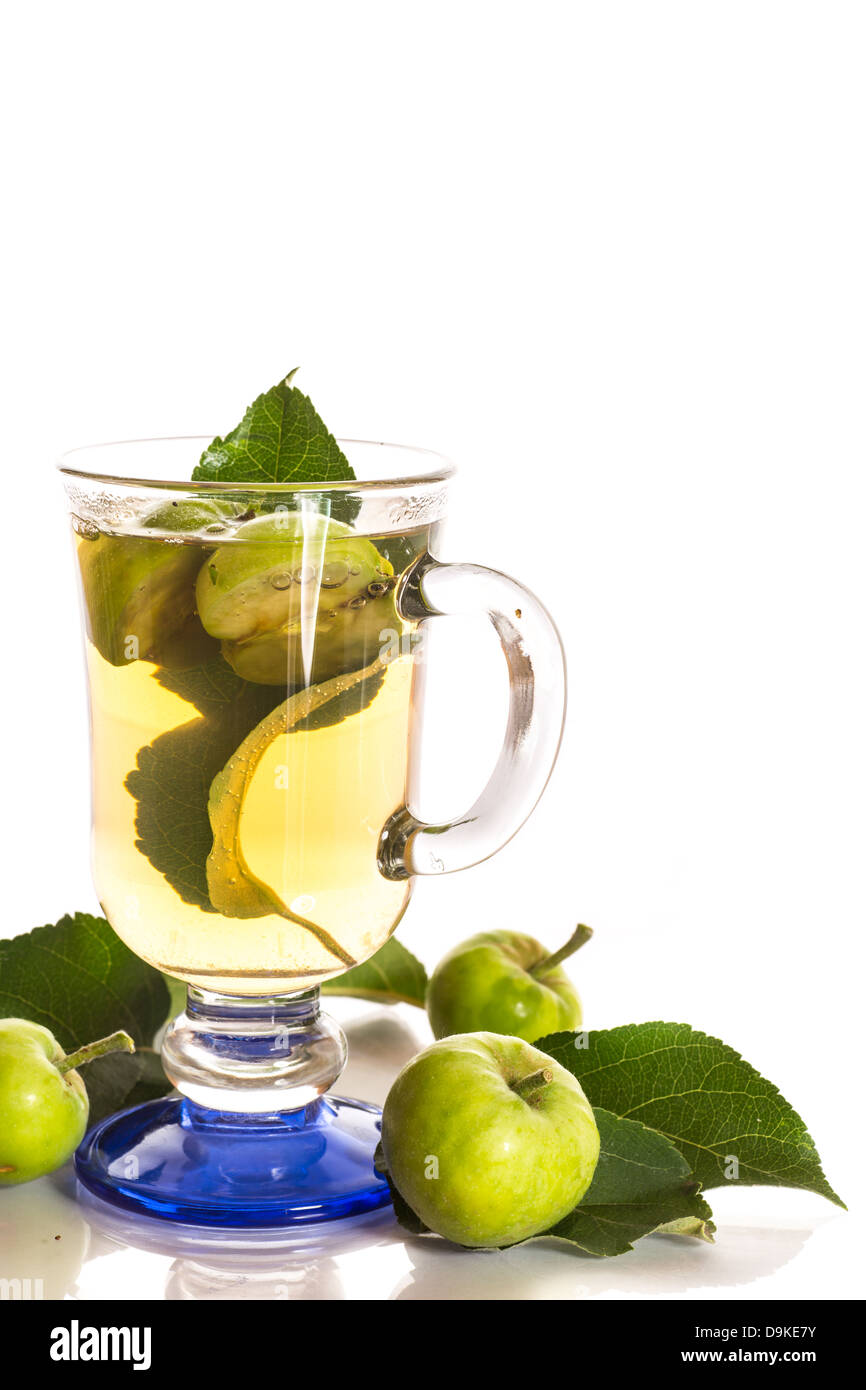 apple tea in a cup on a white background Stock Photo - Alamy