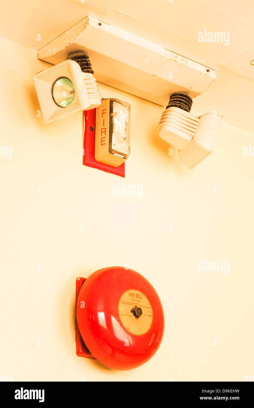 Red fire alarm bell on the wall Stock Photo - Alamy