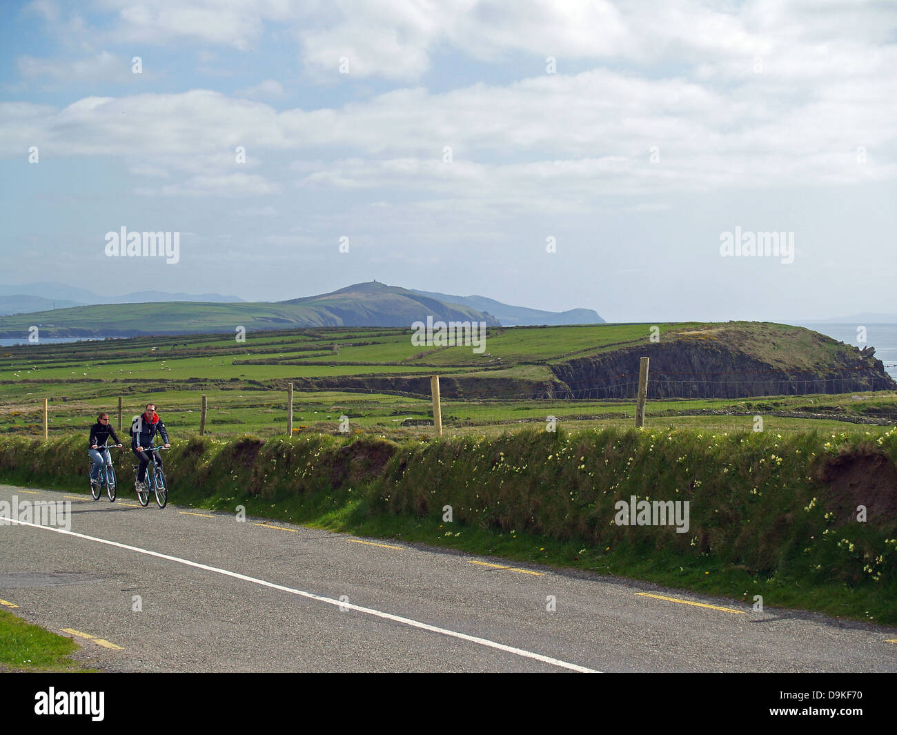 Two cyclists on the Slea Head Drive,Dingle Peninsula,Ireland Stock ...