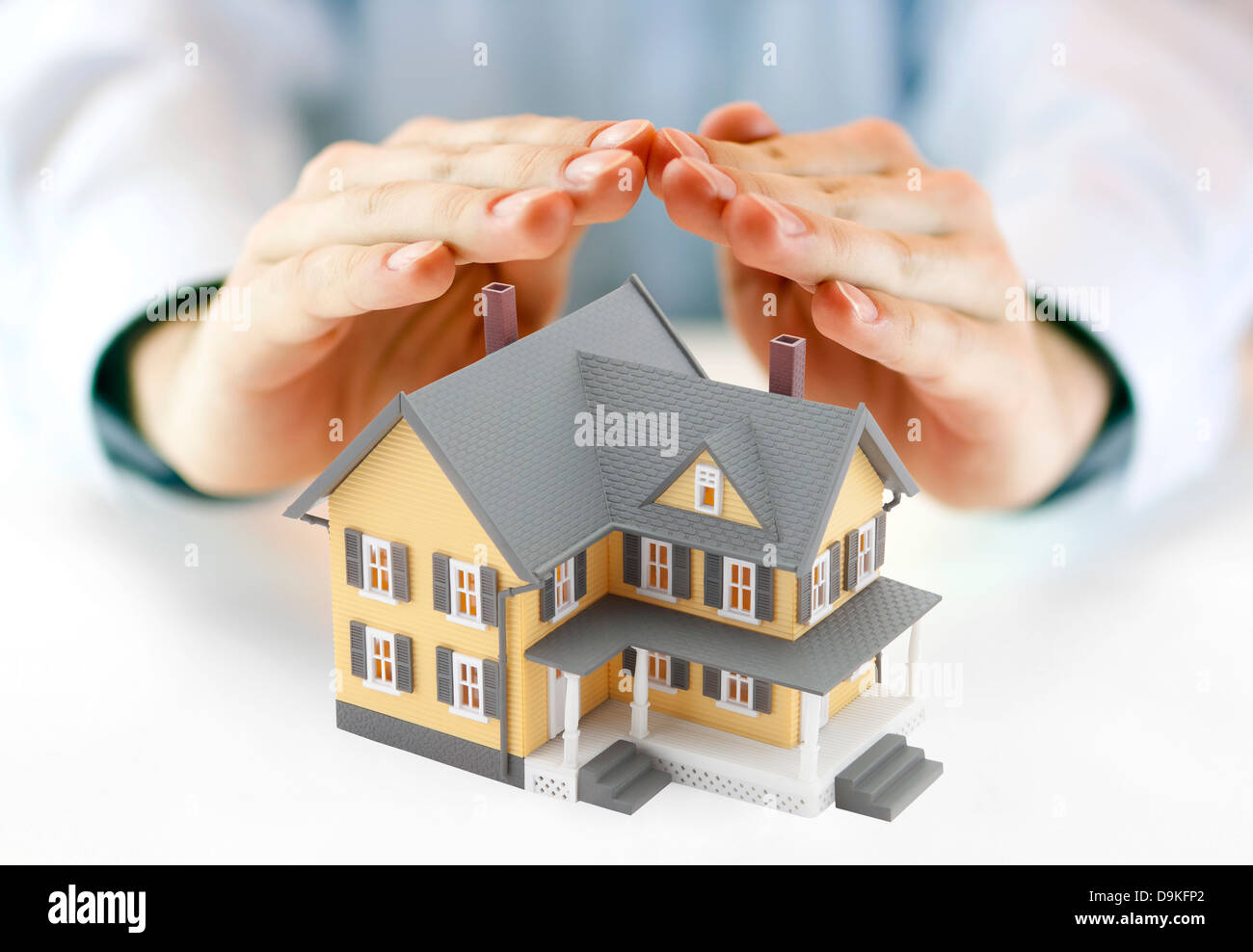 Hands and house model Stock Photo - Alamy
