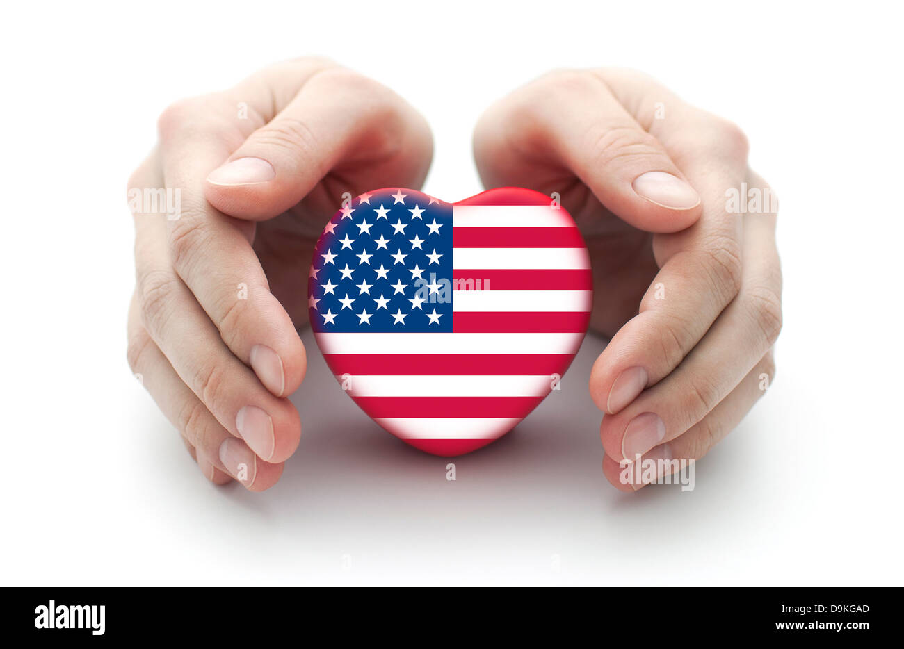 Hands covering U.S. heart on white background Stock Photo - Alamy