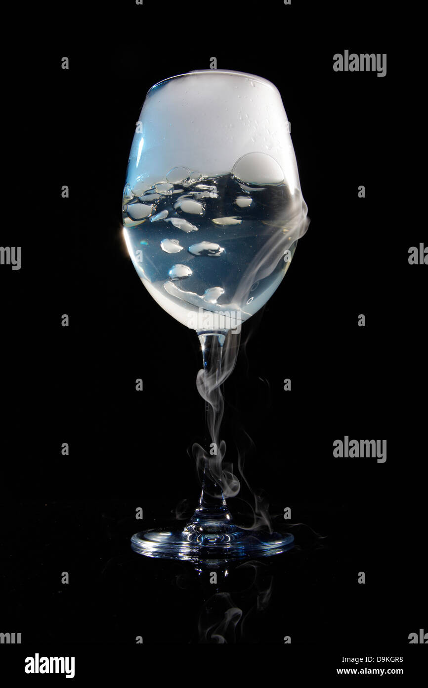 glass with the effect of dry ice Stock Photo - Alamy