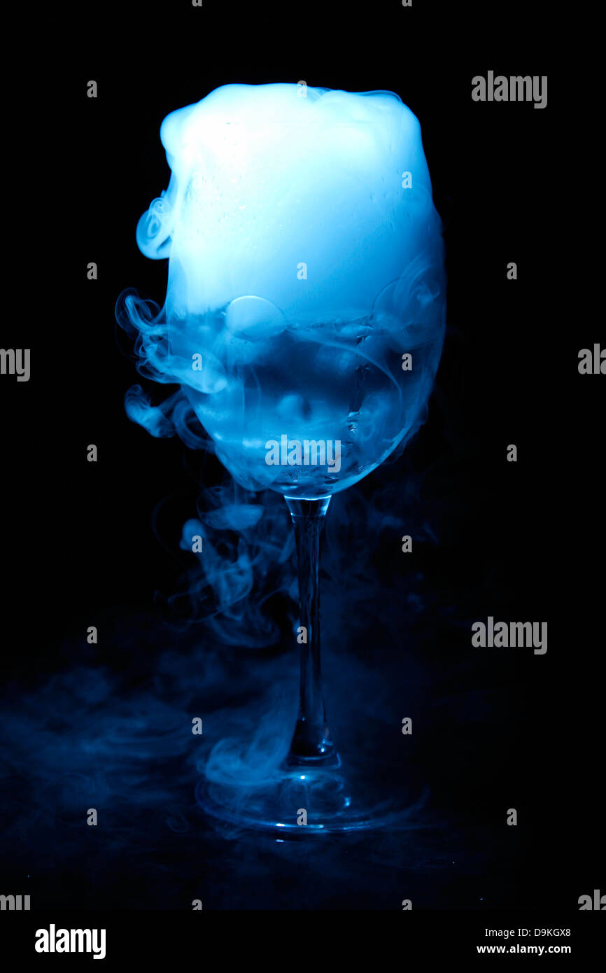 glass with the effect of dry ice Stock Photo - Alamy