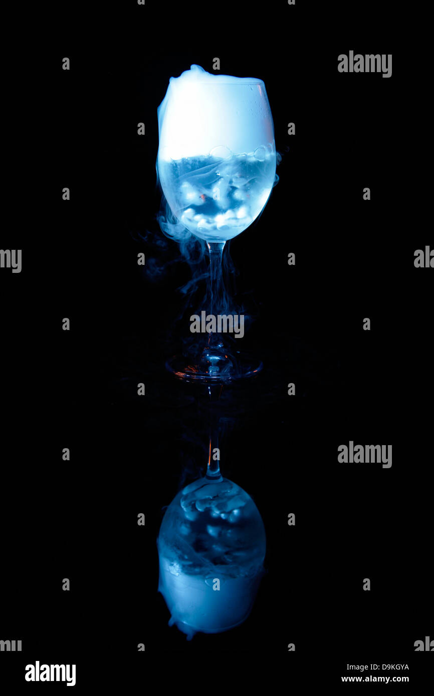 glass with the effect of dry ice Stock Photo - Alamy