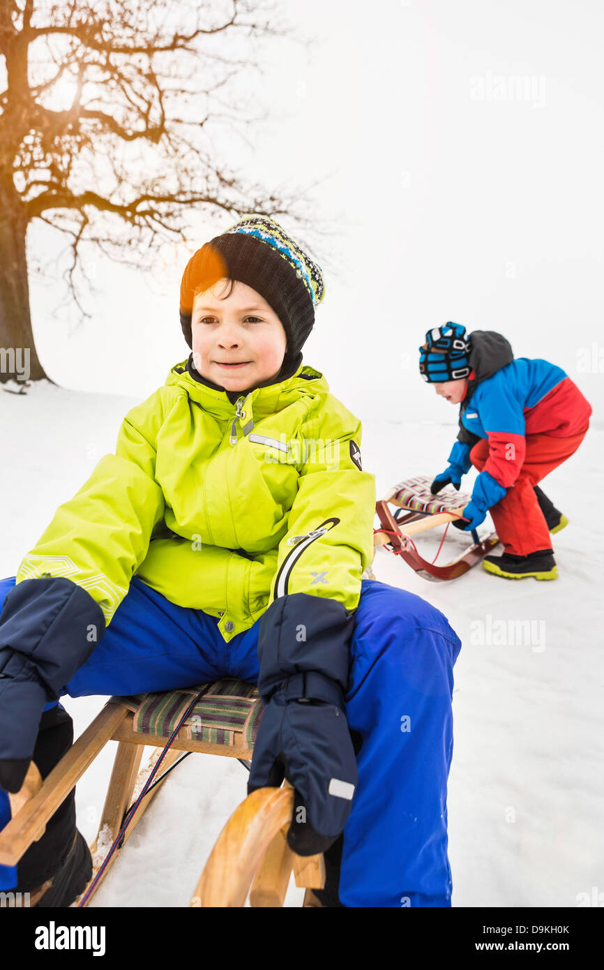 Two boys sitting playing in hi-res stock photography and images - Alamy