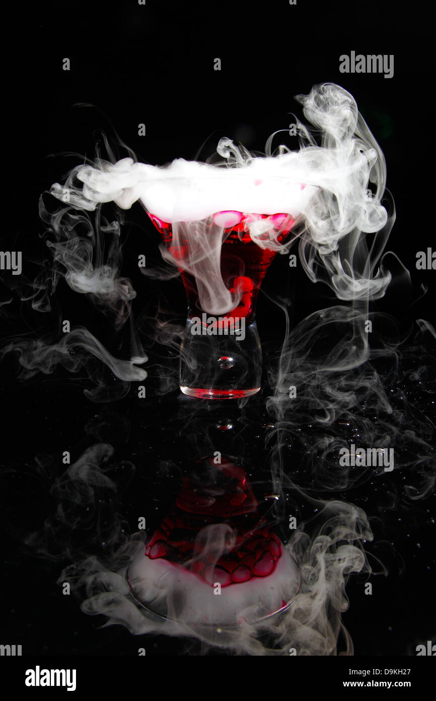 glass with the effect of dry ice Stock Photo - Alamy