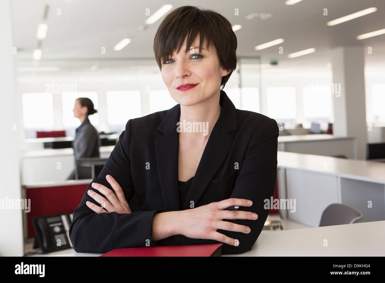 Women with folded arms hi-res stock photography and images - Alamy