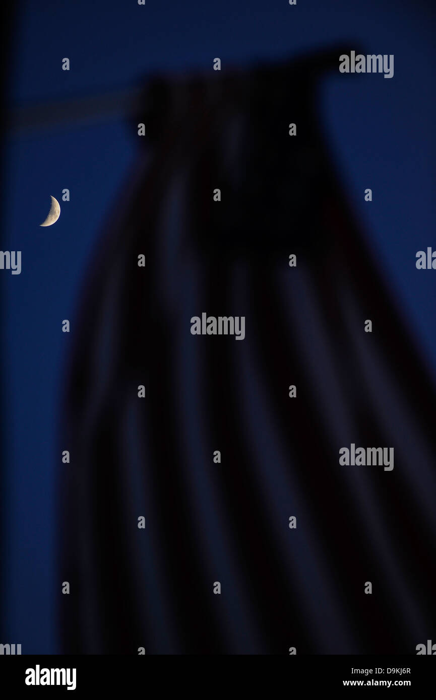 The moon shines bright as evening falls on downtown Vernon, Alabama on ...