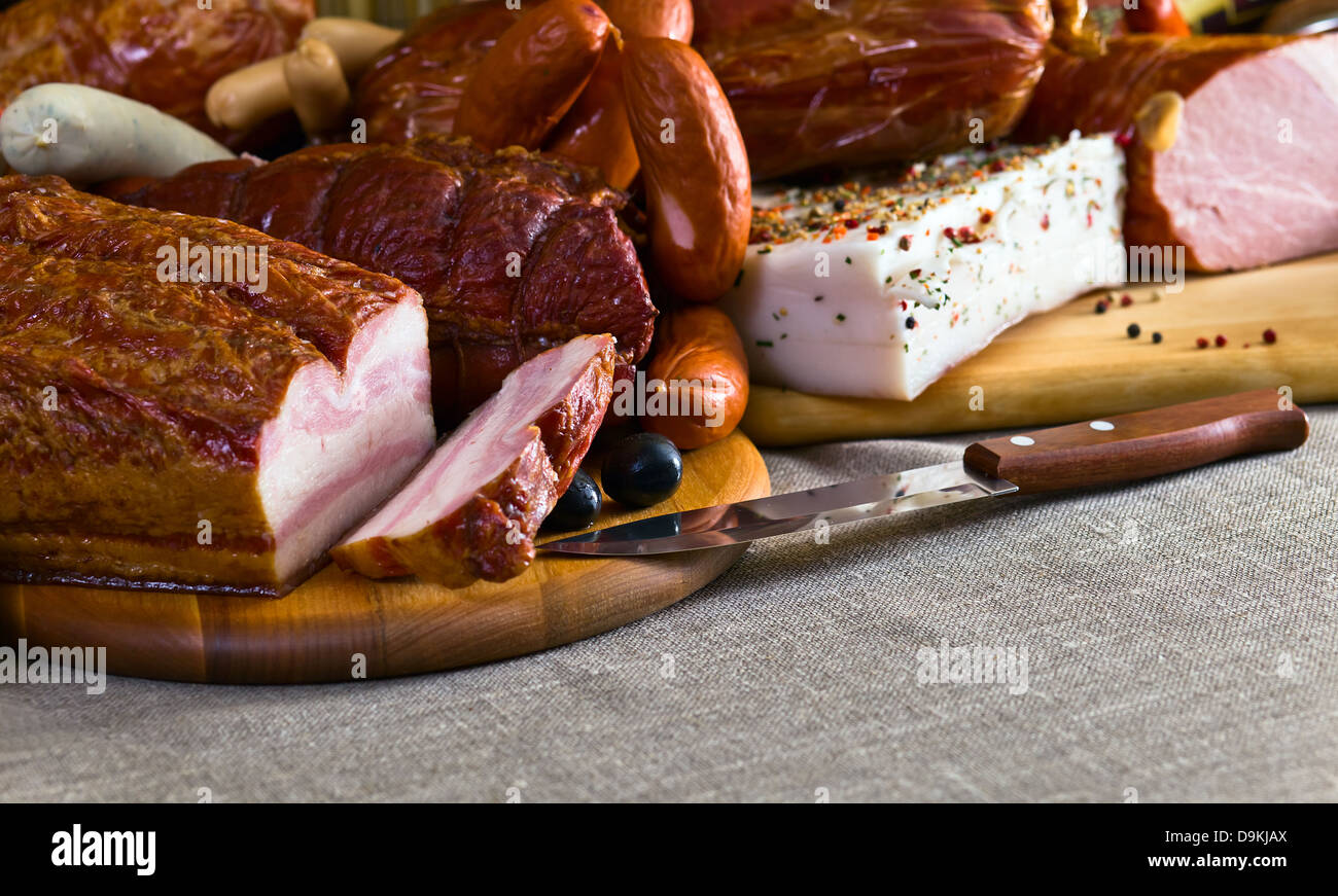 smoked meat and sausages on a linen cloth Stock Photo - Alamy