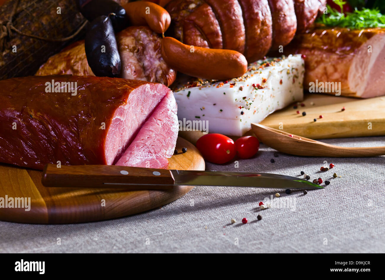 smoked meat and sausages on a linen cloth Stock Photo - Alamy