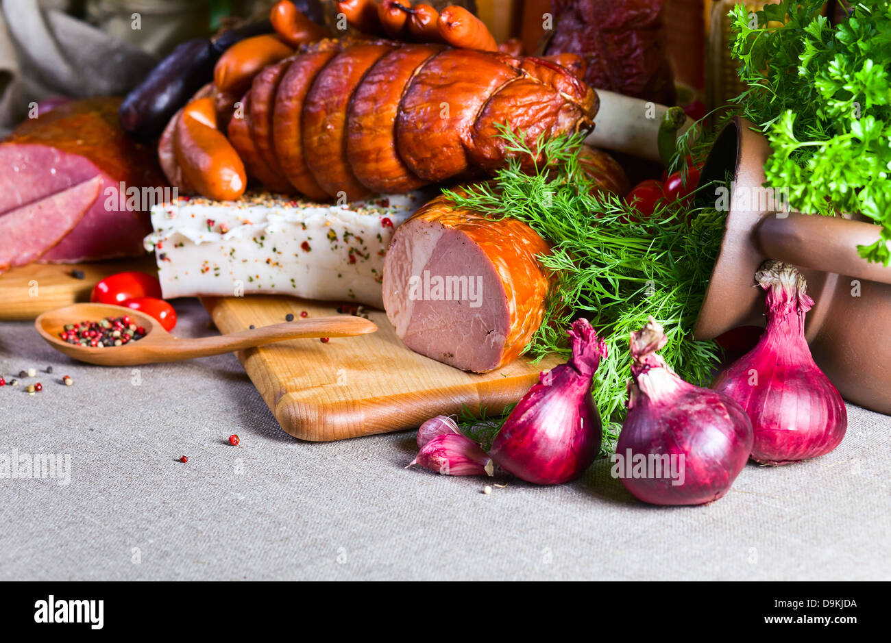 smoked meat and sausages on a linen cloth Stock Photo - Alamy