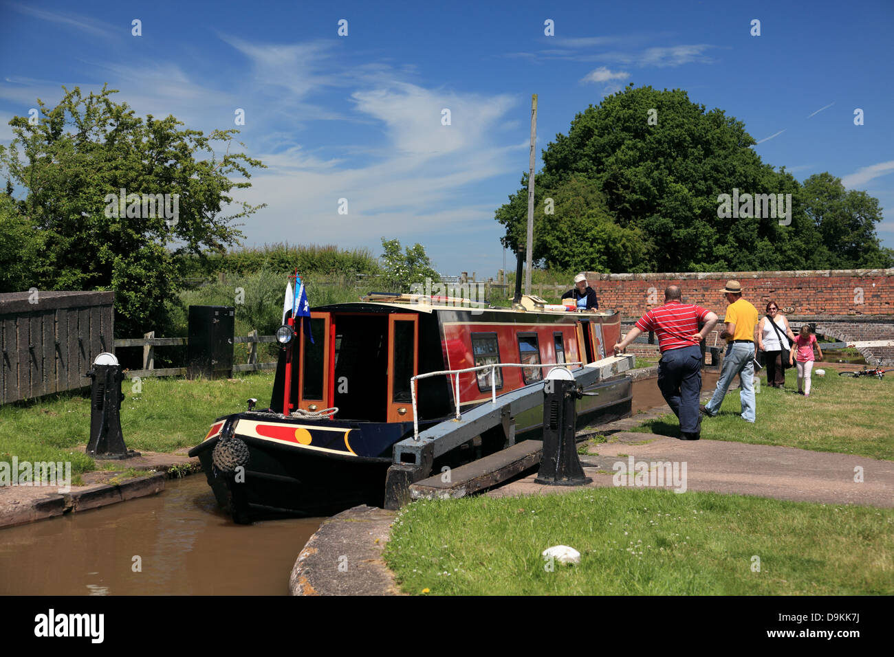 A narrowboat going south through the top lock of the Audlem flight of ...