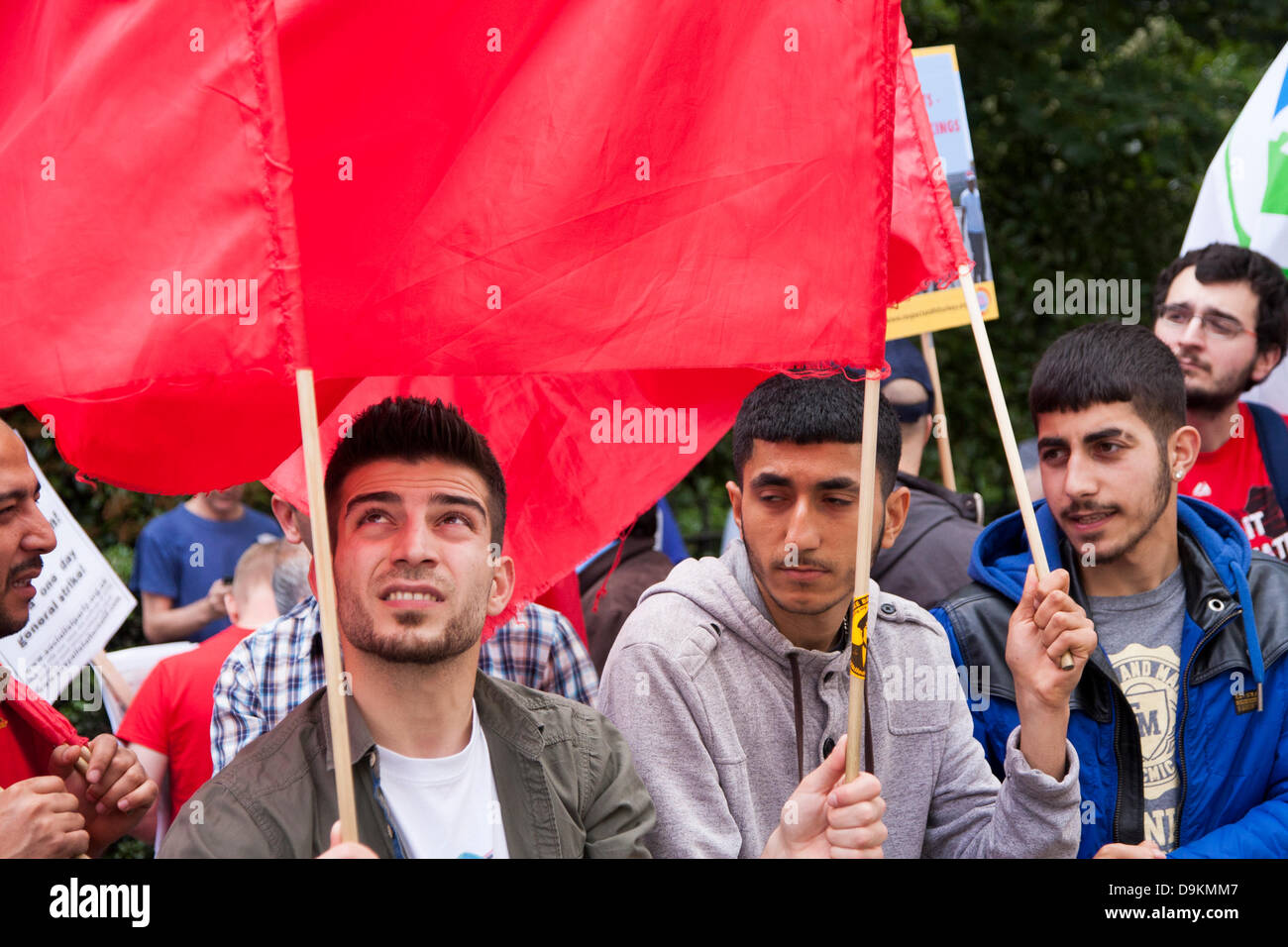 London, UK. 21st June 2013. Deonstrators with their flags as British ...