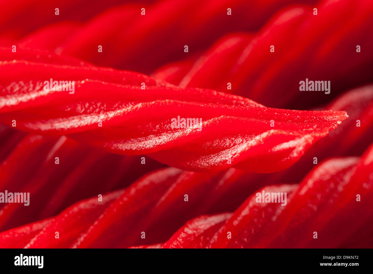 Bright Red Licorice Candy shaped like a twisted rope Stock Photo - Alamy
