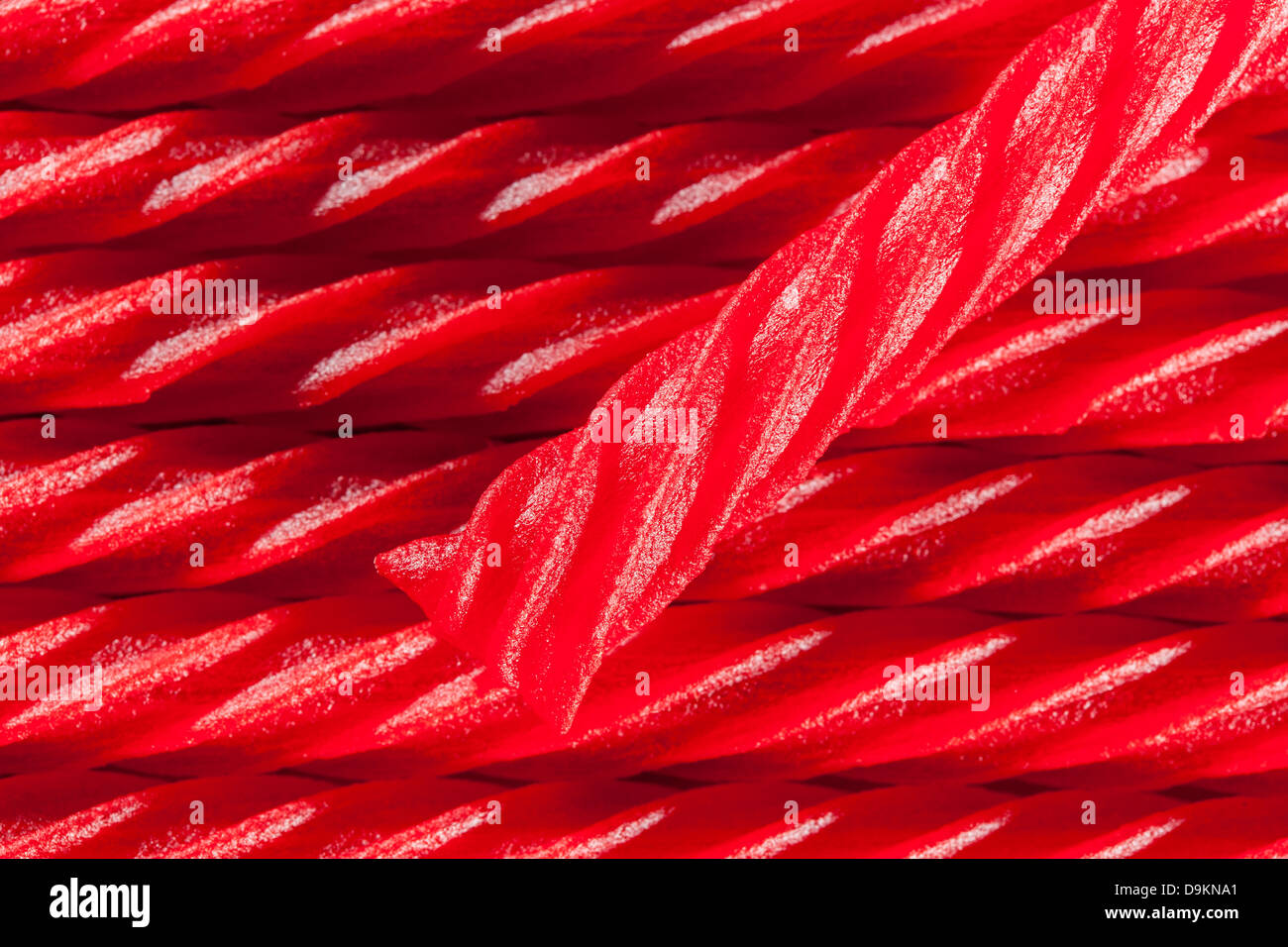 Bright Red Licorice Candy shaped like a twisted rope Stock Photo - Alamy