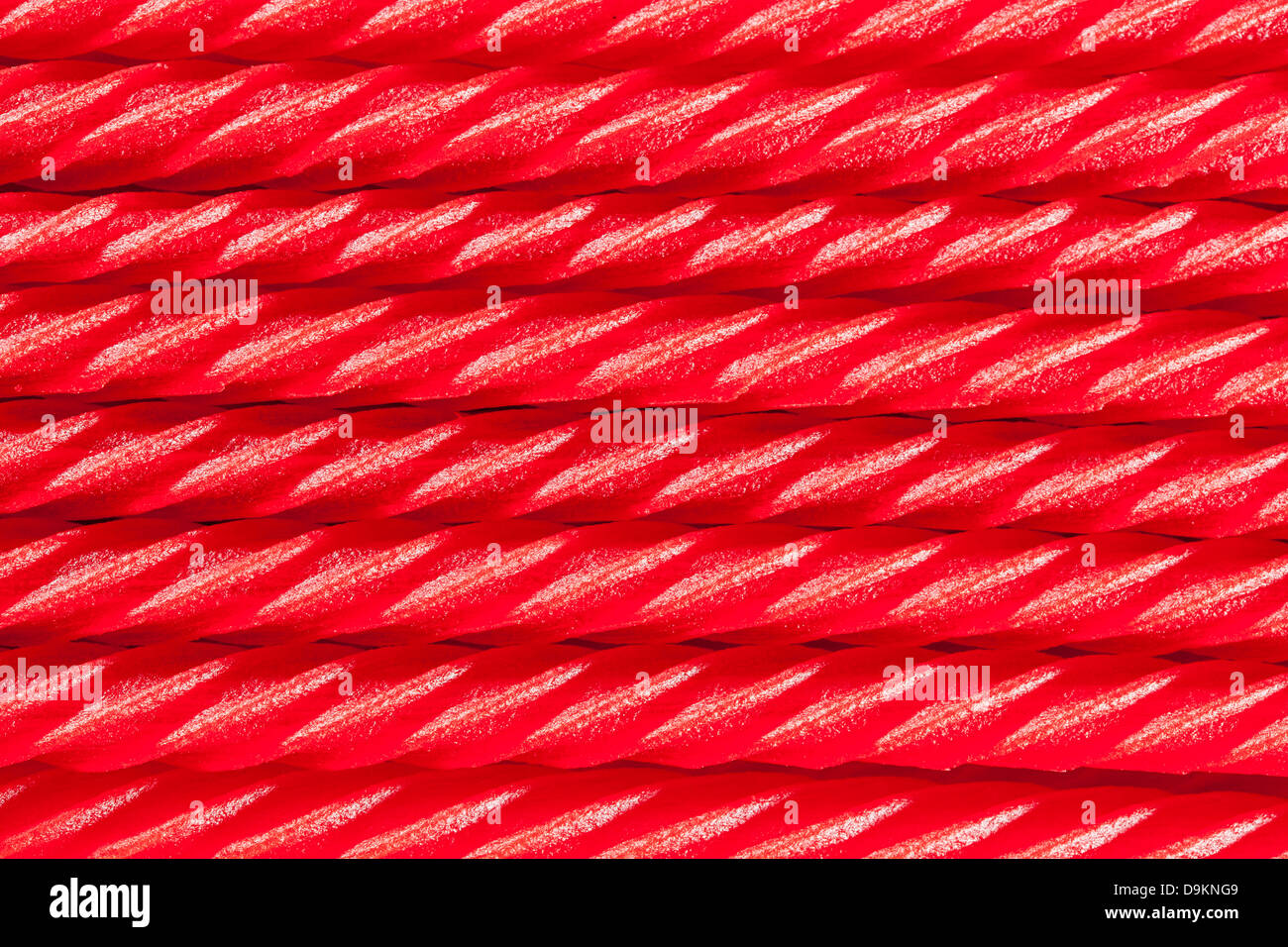 Bright Red Licorice Candy shaped like a twisted rope Stock Photo - Alamy