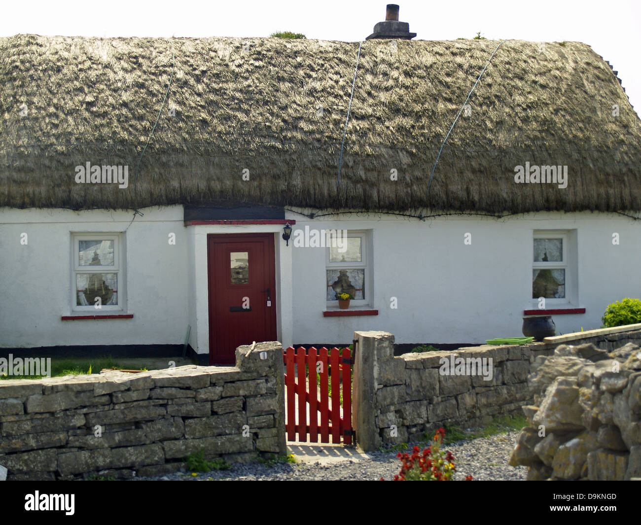 A thatched roof cottage in Kilronan,Inishmore of the Aran Islands ...