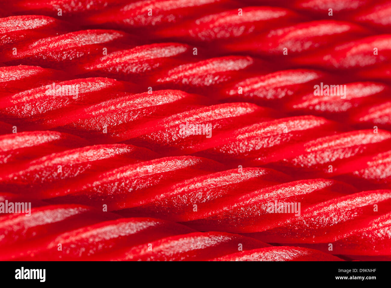 Bright Red Licorice Candy shaped like a twisted rope Stock Photo - Alamy