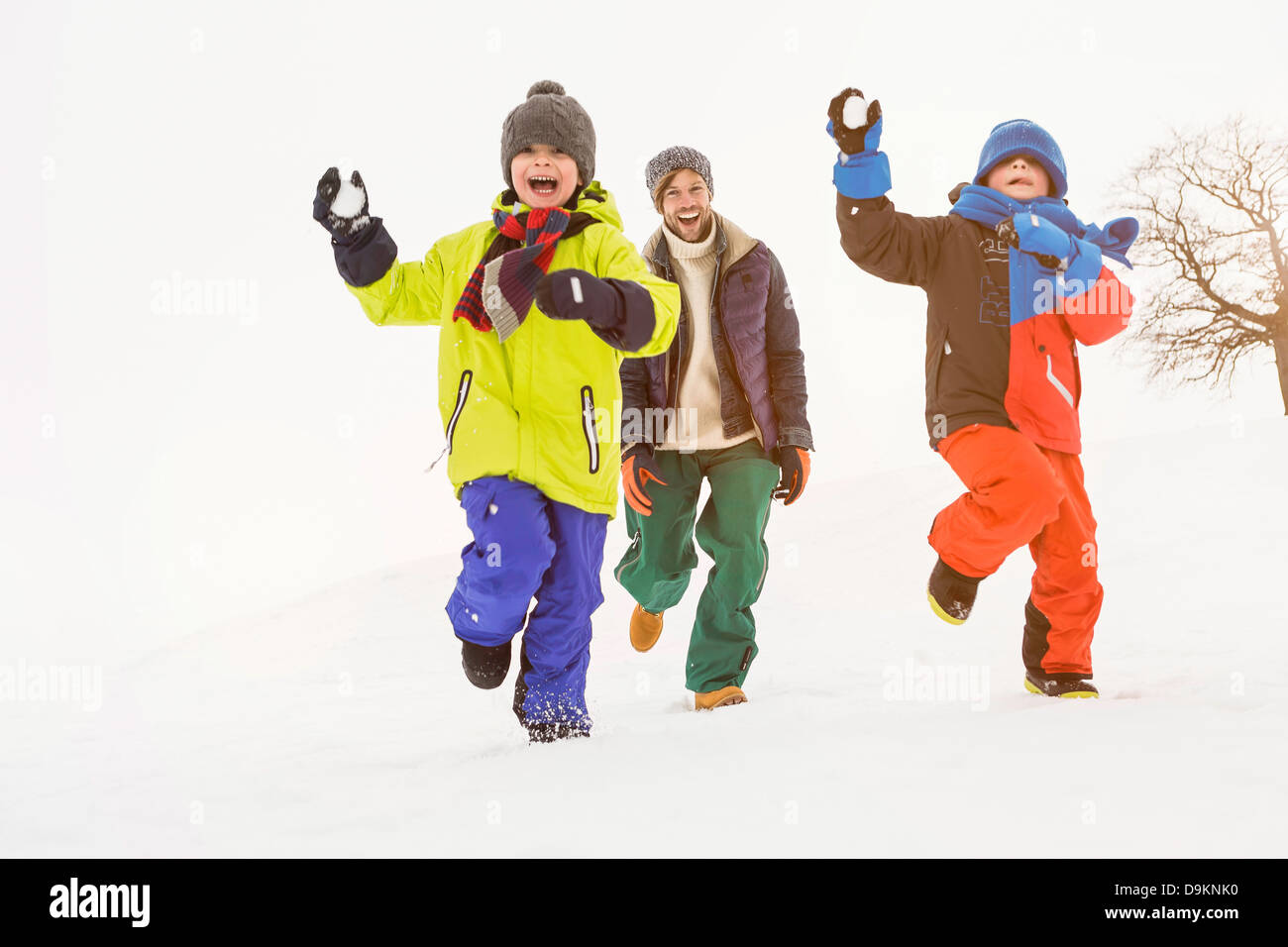 Boys throwing snowballs hi-res stock photography and images - Alamy