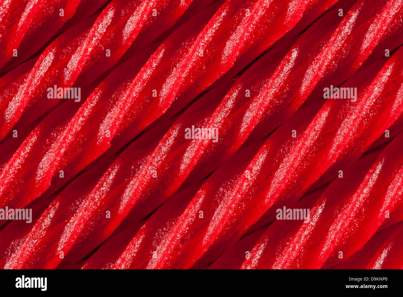 Bright Red Licorice Candy shaped like a twisted rope Stock Photo - Alamy