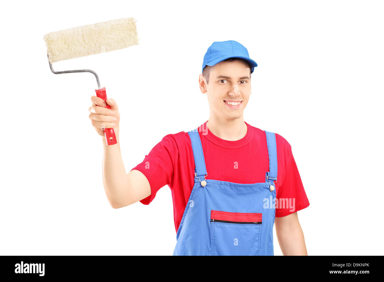 Smiling painter in a uniform holding a roller Stock Photo - Alamy