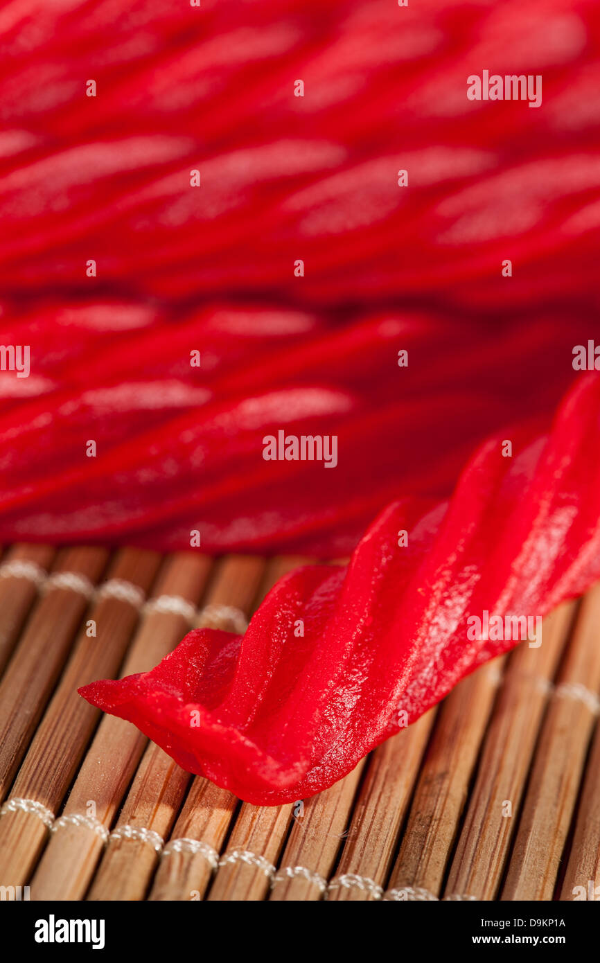Bright Red Licorice Candy shaped like a twisted rope Stock Photo - Alamy