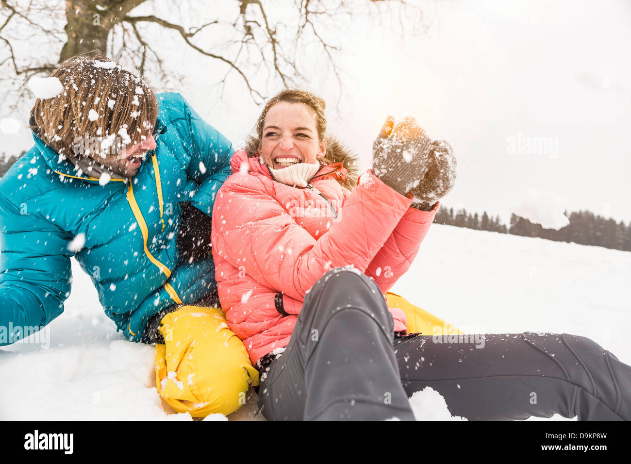 Woman play snow hi-res stock photography and images - Alamy