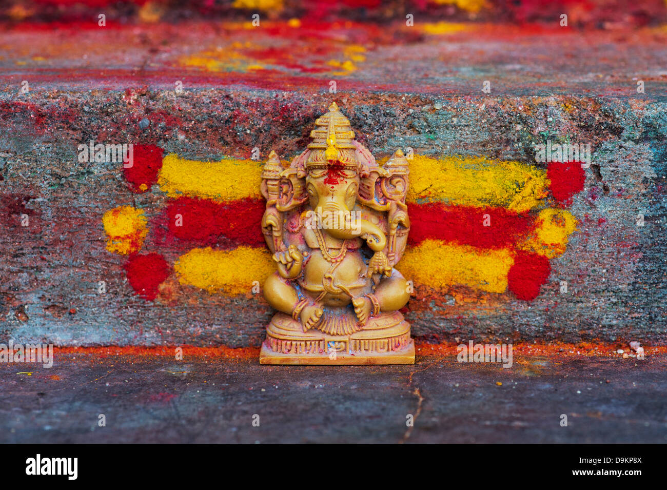 Hindu Elephant God. Lord Ganesha statue against coloured hindu temple ...