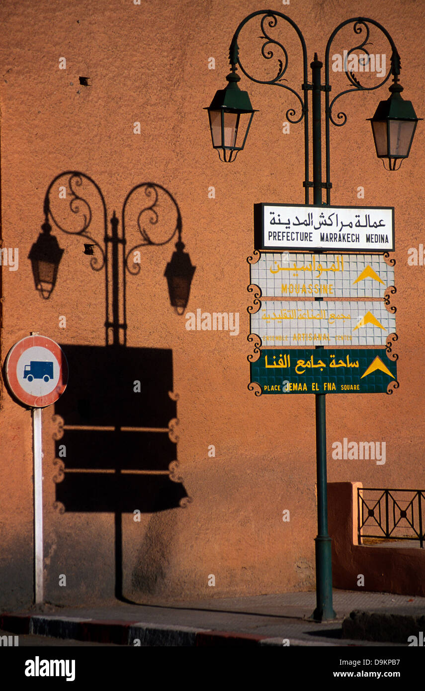 Shadow of a lamp-post which has writing on it. This is the entrance to ...